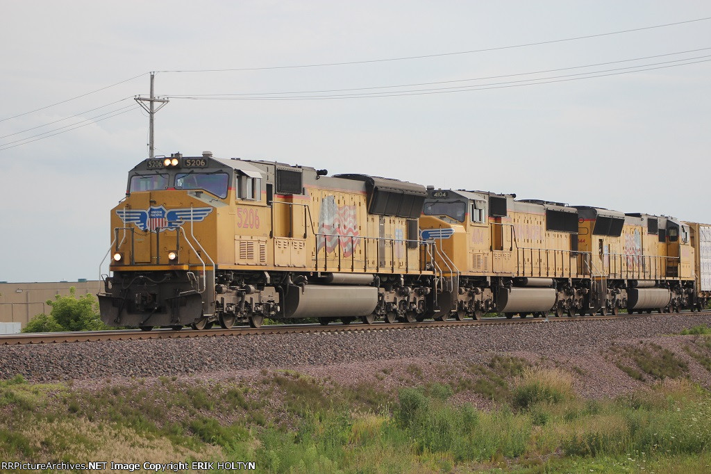 UP Eastbound mixed freight . West of the diamonds